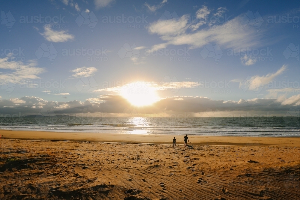 Image of Sunrise family walk on the beach in Mackay Queensland ...