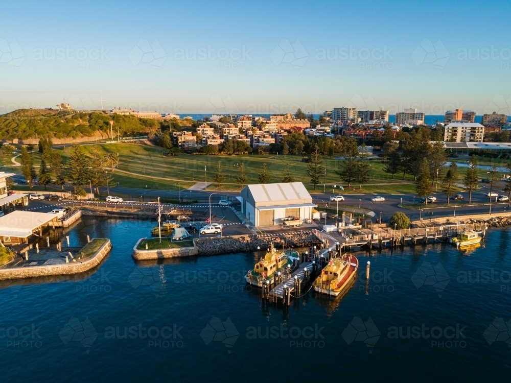 Image of Sunset light on boats at Newcastle foreshore seen from aerial ...
