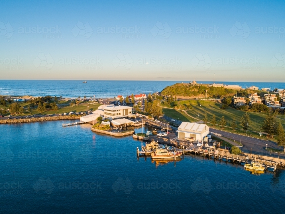 Image of Sunset light on boats at Newcastle foreshore seen from aerial ...
