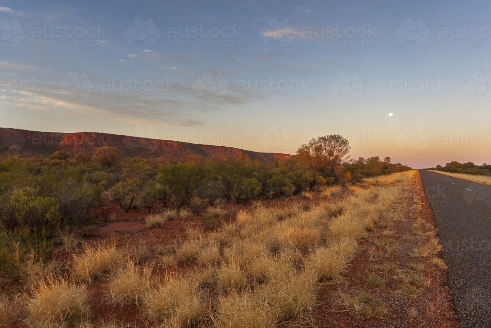 Image of Sunset on a roadside in arid Australia - Austockphoto