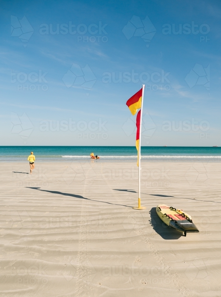 Image of Surf Lifesavers and Flag on Cable Beach - Austockphoto