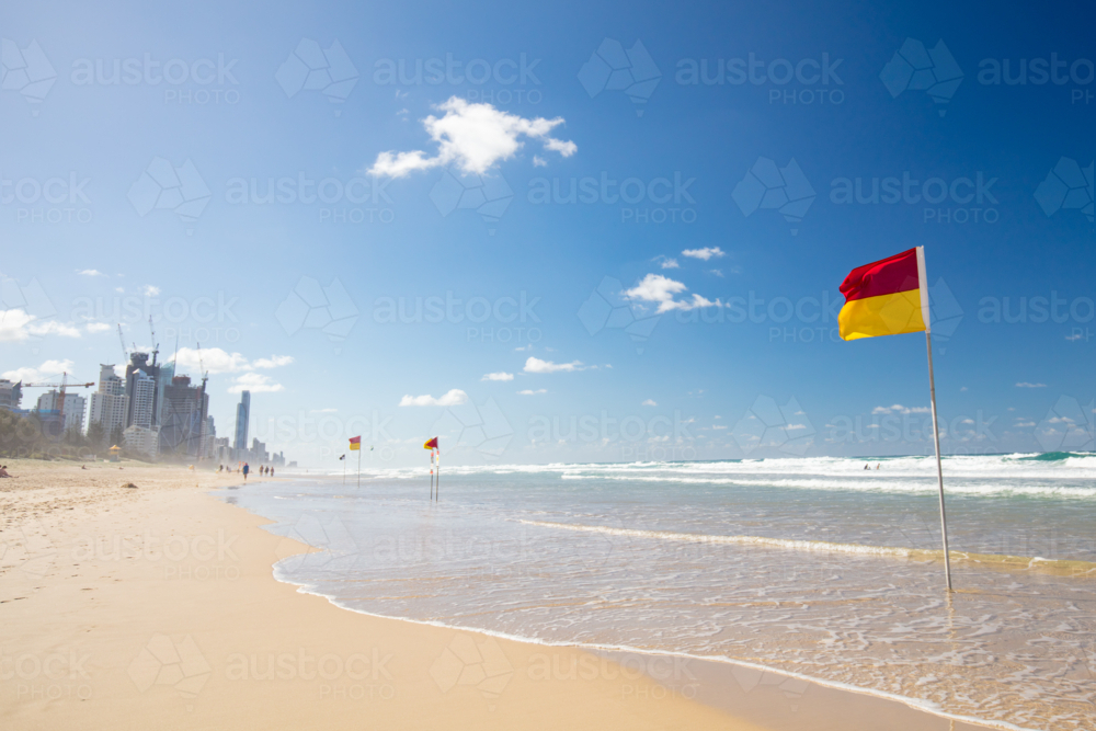 Image of Surf lifesaving flags on a hot sunny day in Broadbeach, Gold ...