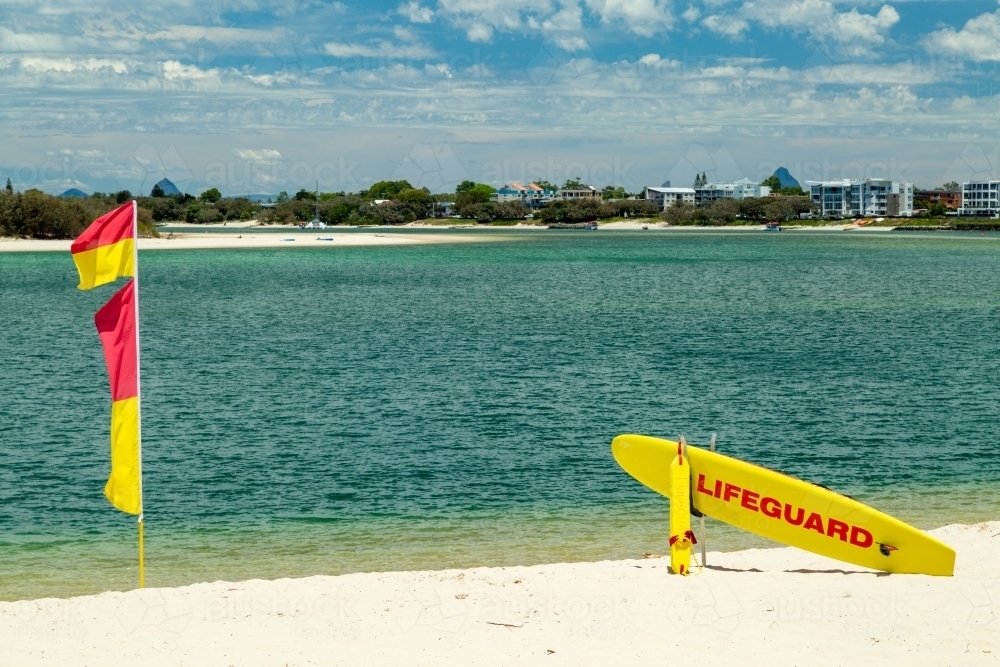Image of Surf lifesaving flags on beach and rescue board at Bulcock ...