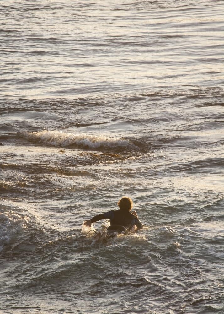 Image of surfer paddling out to a break - Austockphoto Image of surfer paddling out to a break - Austockphoto