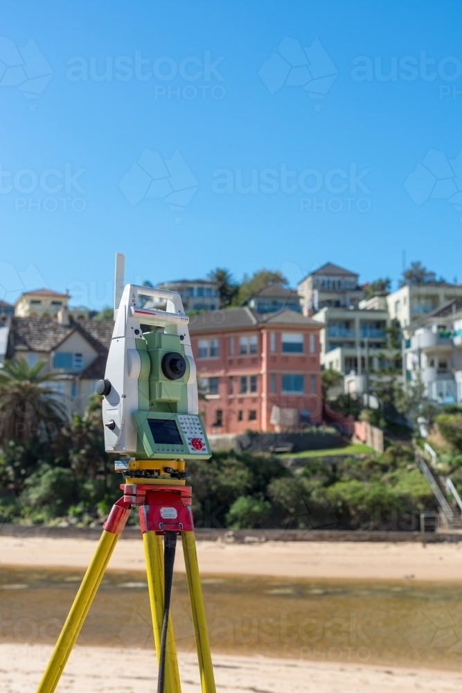 Image of Survey equipment on tripod at beach - Austockphoto