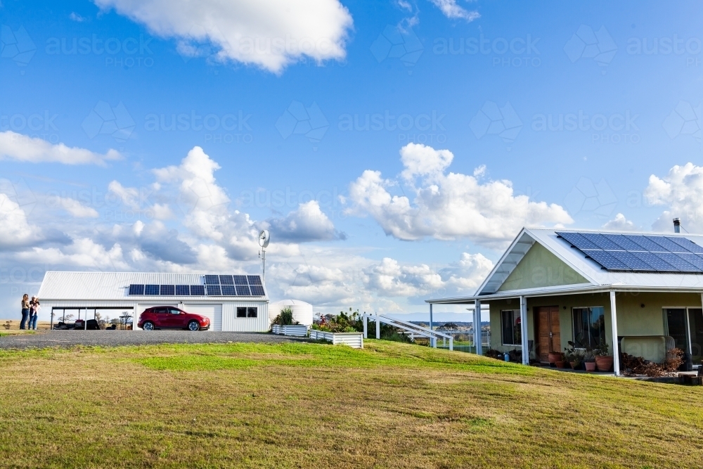 Image of Sustainable off grid living with solar panels on house and ...