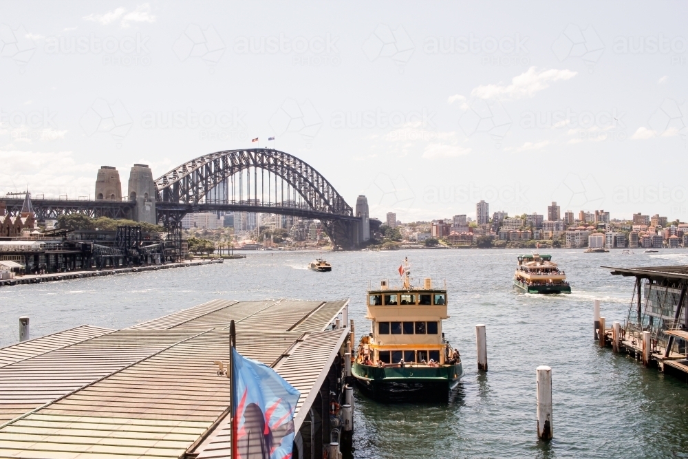 Image of Sydney Harbour with Ferries in foreground and bridge ...