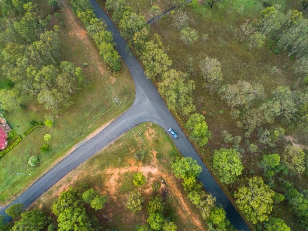 Image of T intersection of rural roads seen from overhead - Austockphoto