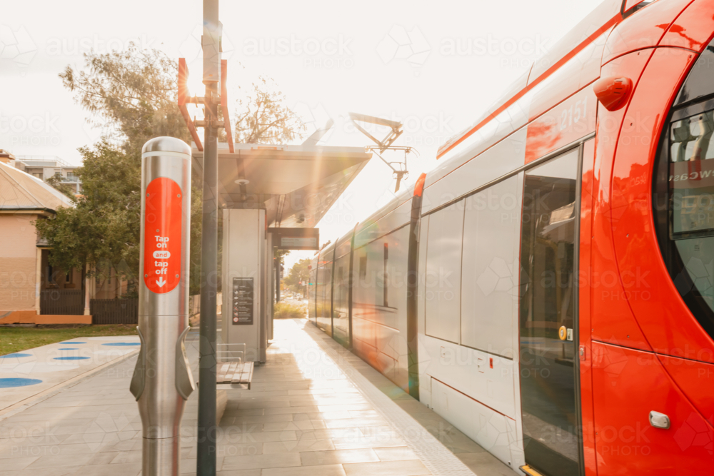 Image of Tap on and tap off sign at light rail stop - Austockphoto
