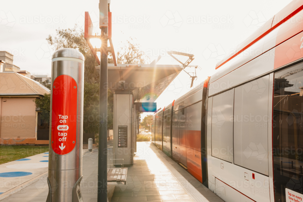 Image of Tap on and tap off sign at light rail stop - Austockphoto