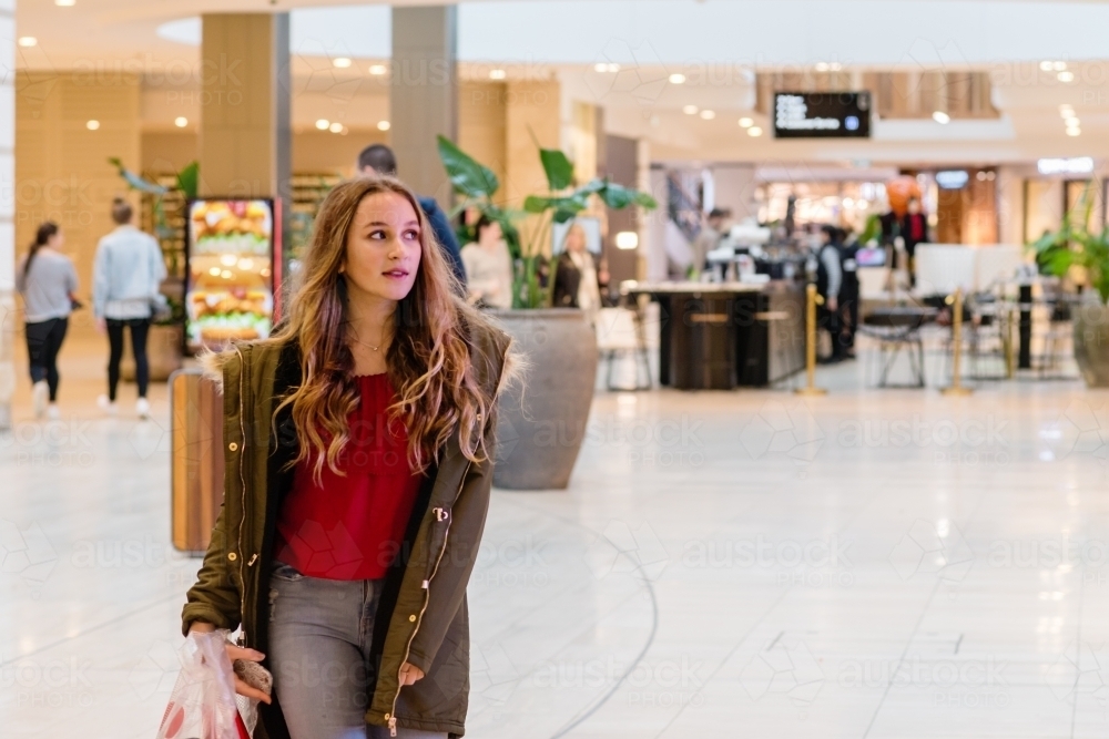 Image of teen at the shopping mall - Austockphoto