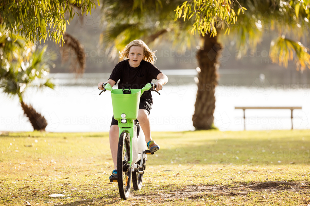 Image of Teenage boy riding public motorised bike in Gold Coast park ...