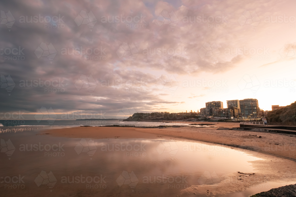 Image of The Canoe Pool at Newcastle Beach at sunset - Austockphoto
