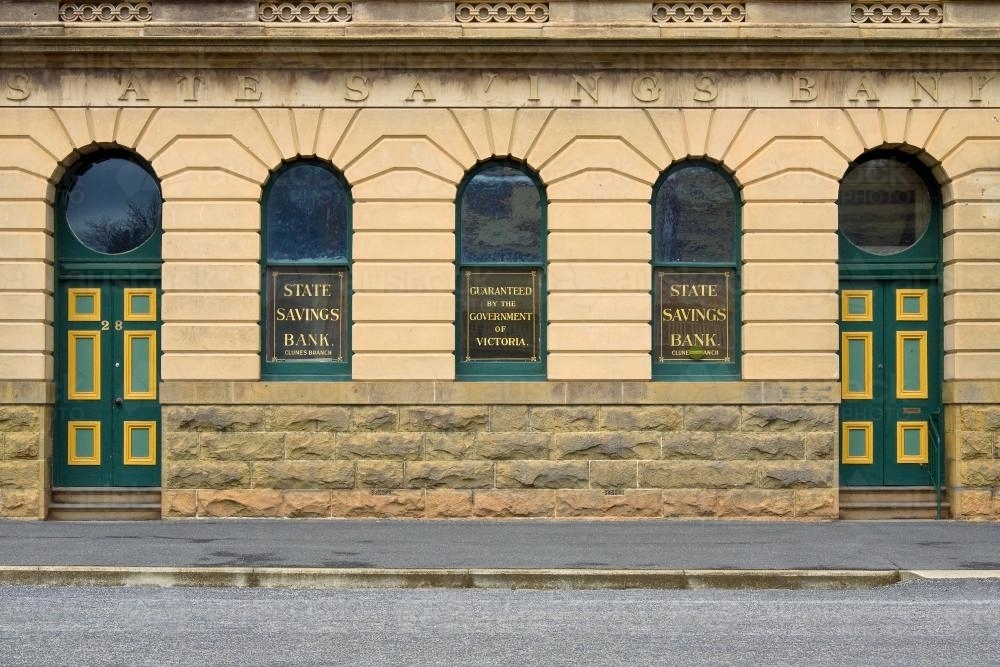 Image of The facade of an old bank building - Austockphoto