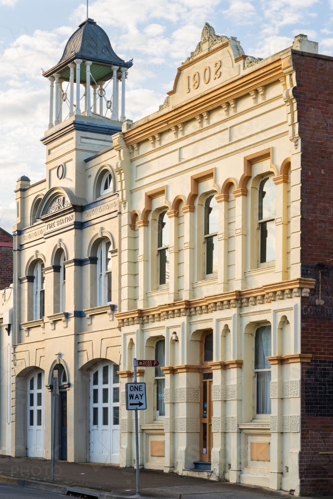 Image of The grand facade of an historic fire station with large doors ...