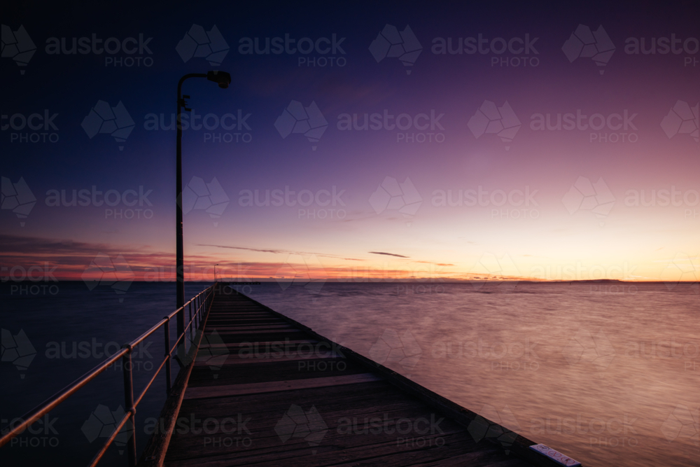 Image of The iconic Rye Pier on a cool winter's morning at sunrise on ...