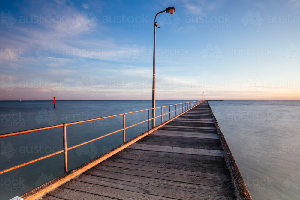 Image of The iconic Rye Pier on a cool winter's morning at sunrise on ...