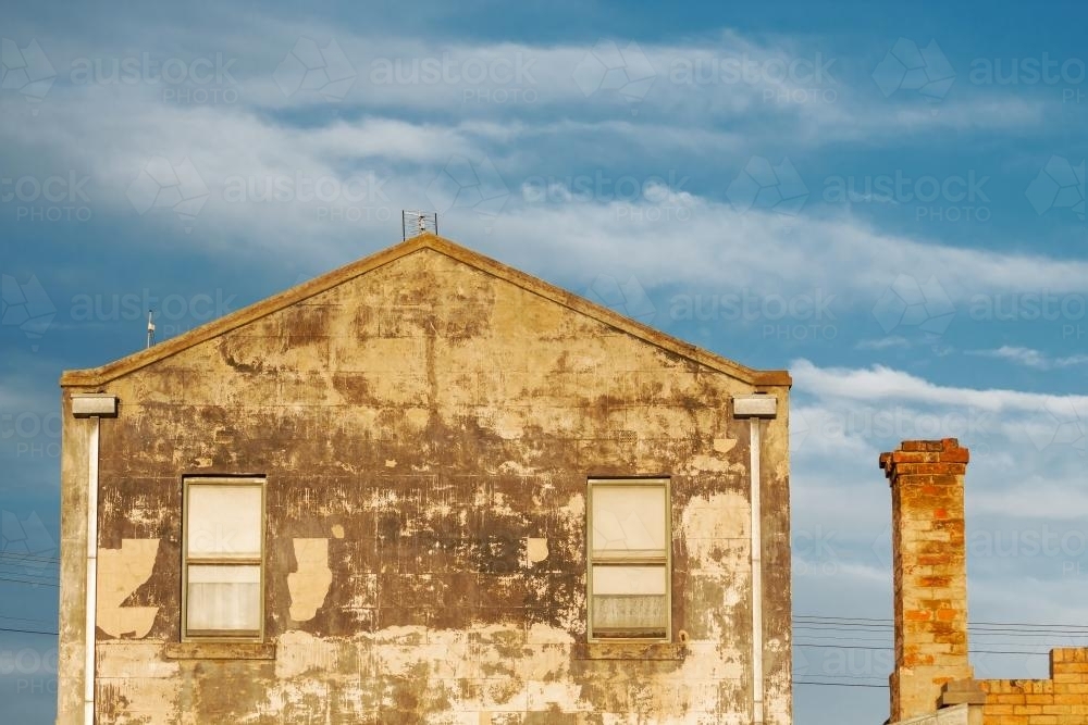Image of The side of a decaying building - Austockphoto