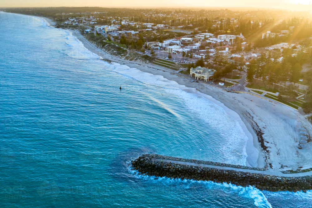 Image of The sun rising on the horizon in an aerial view of Perth's ...