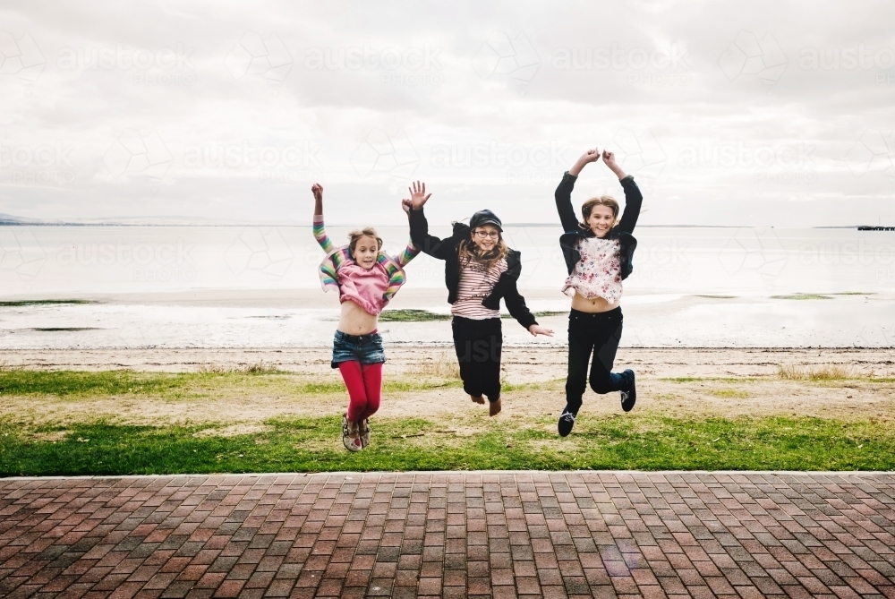 Three Girls Jumping