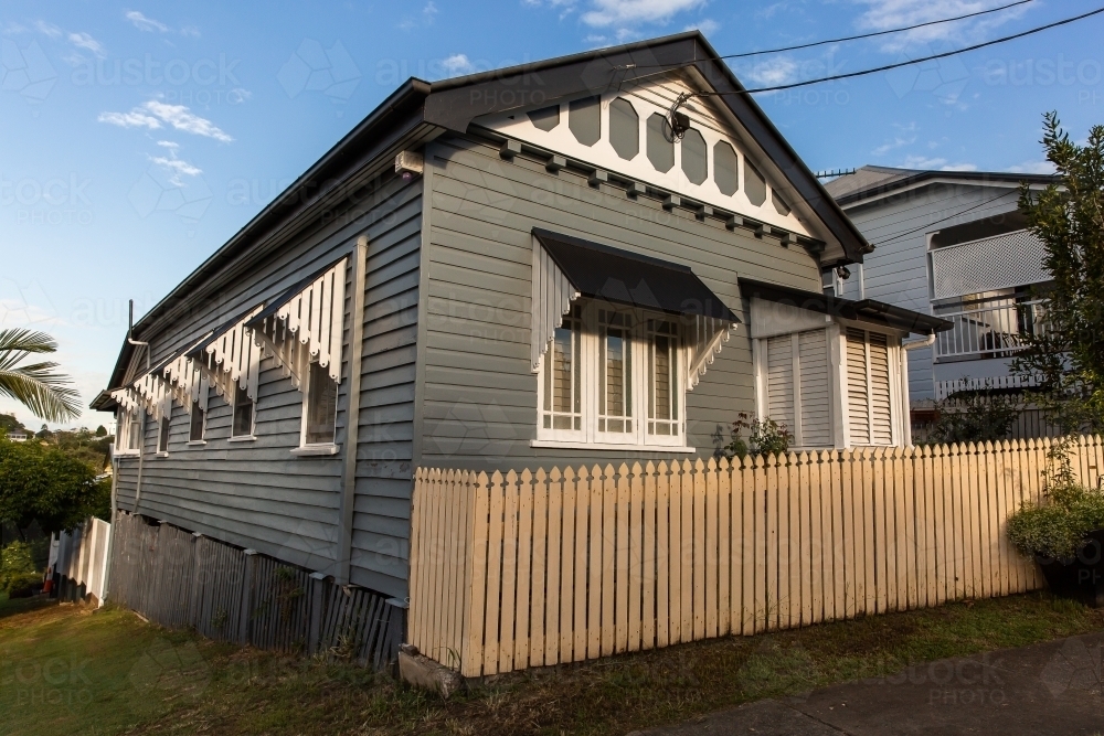 Image of timber weatherboard house in the afternoon light in Brisbane ...