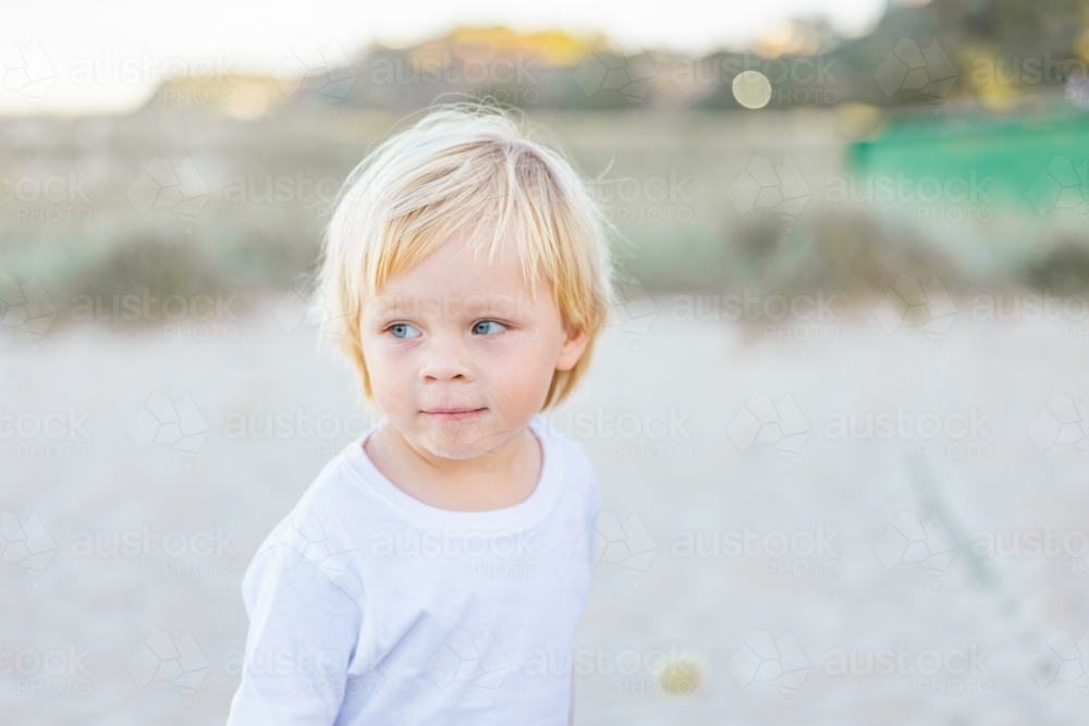 Image of Toddler boy exploring Gold Coast beach - Austockphoto
