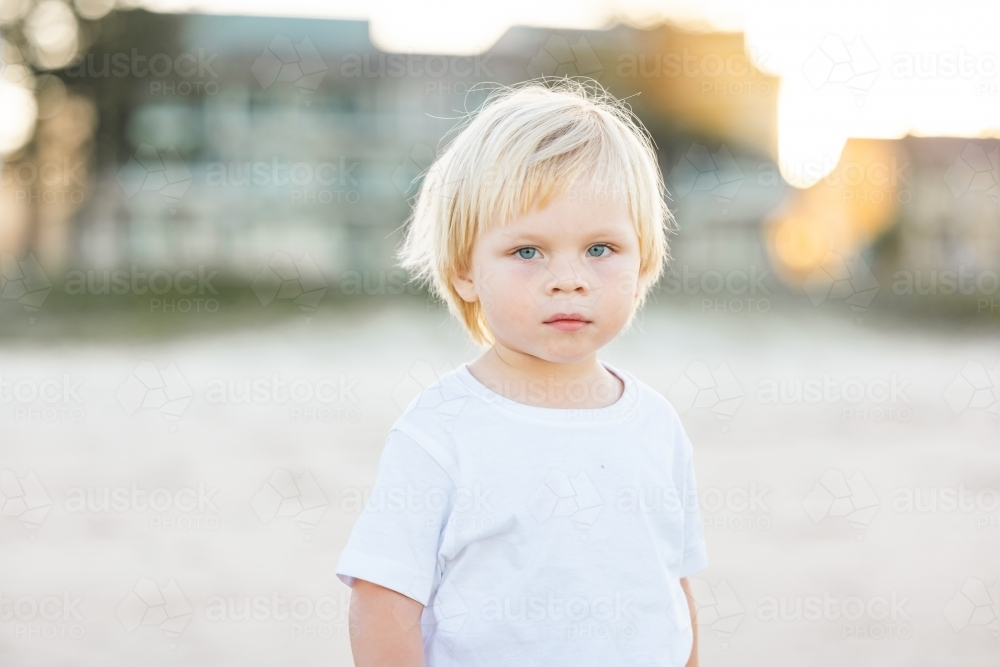 Image of Toddler boy exploring Gold Coast beach - Austockphoto