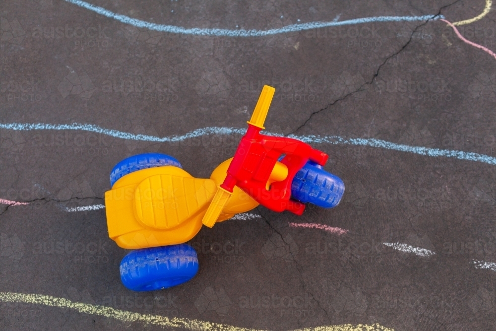 Image of Toddlers tricycle on driveway with chalk bike track drawn on ...