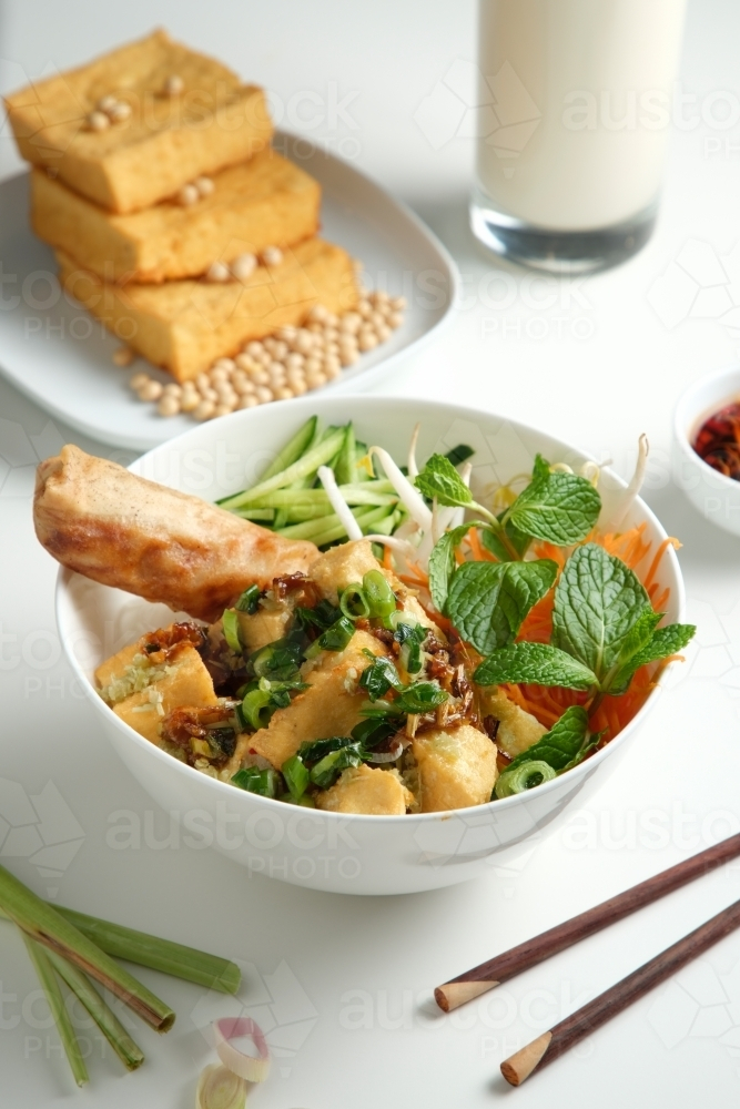 Image of Tofu Bun Cha Gio bowl topped with fried spring roll ...