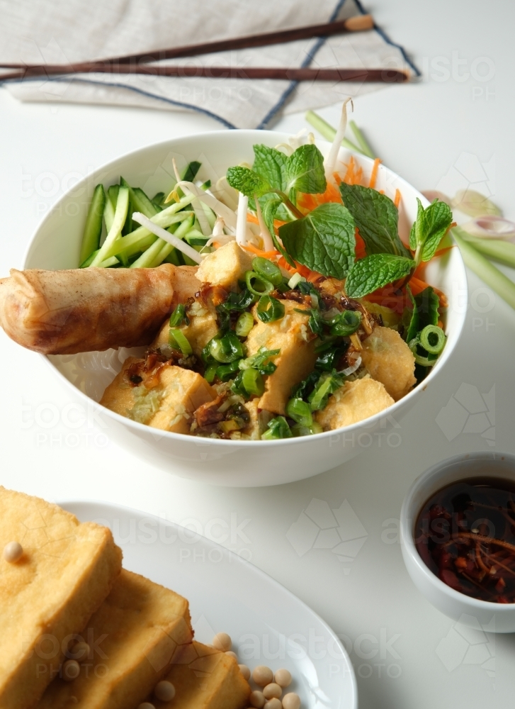 Image of Tofu Bun Cha Gio bowl topped with fried spring roll ...