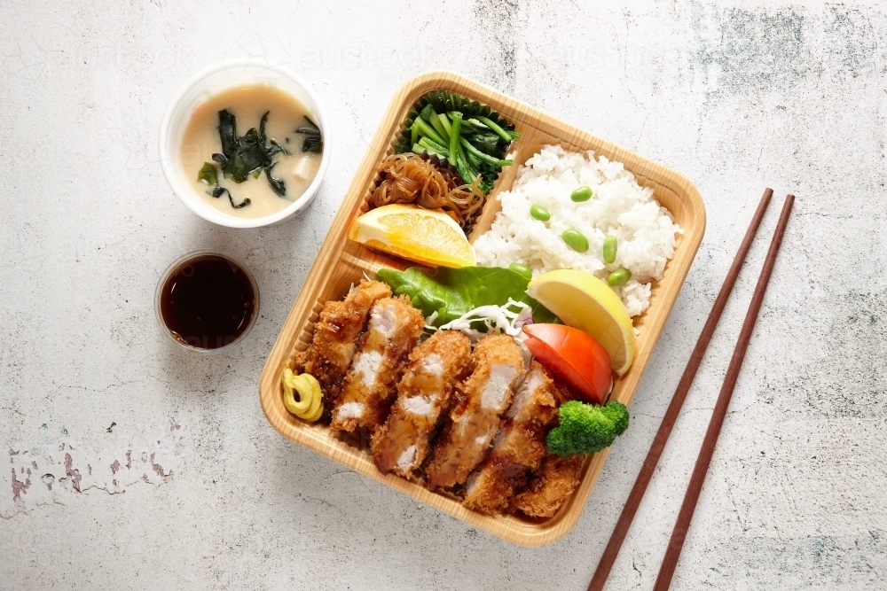 Image of Tonkatsu pork bento with miso dish on table - Austockphoto