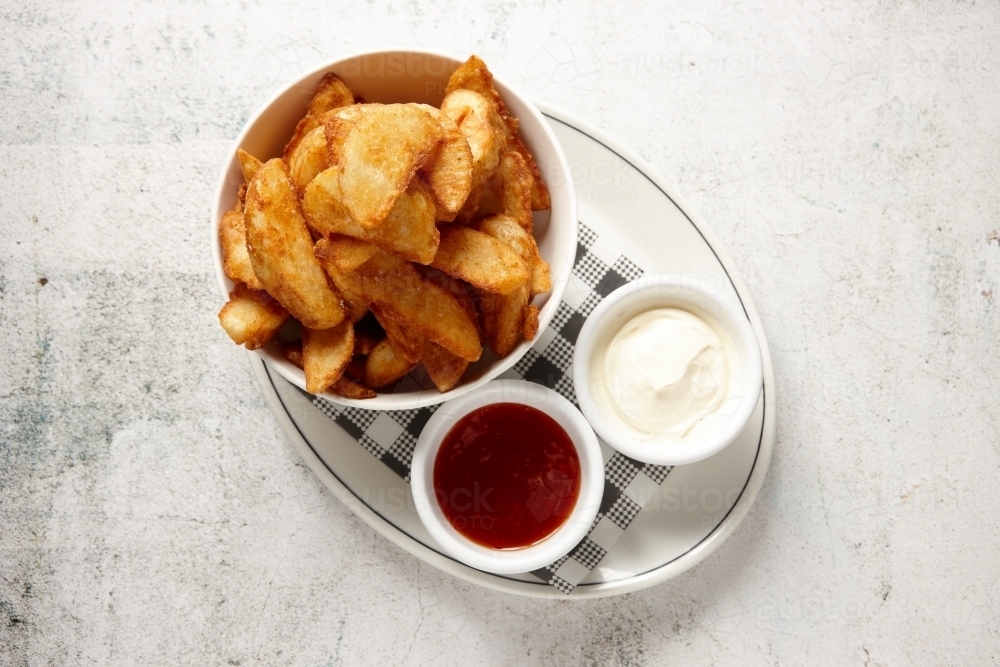 Image of Top down view of bowl of wedges with sweet chilli and sour ...