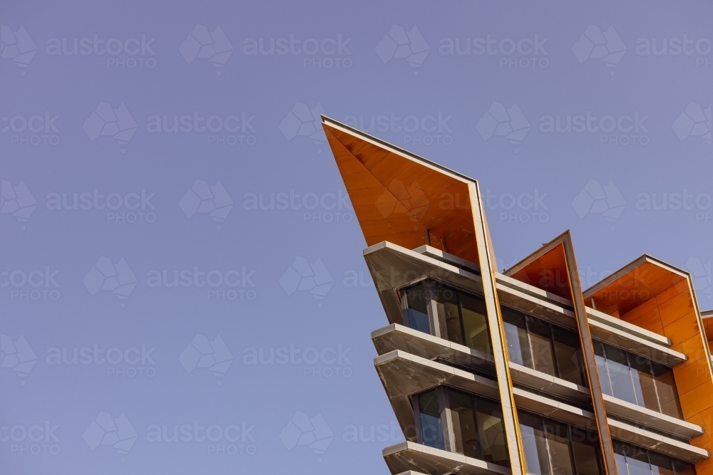 Image of Top floors of high rise office building with pointed roof ...