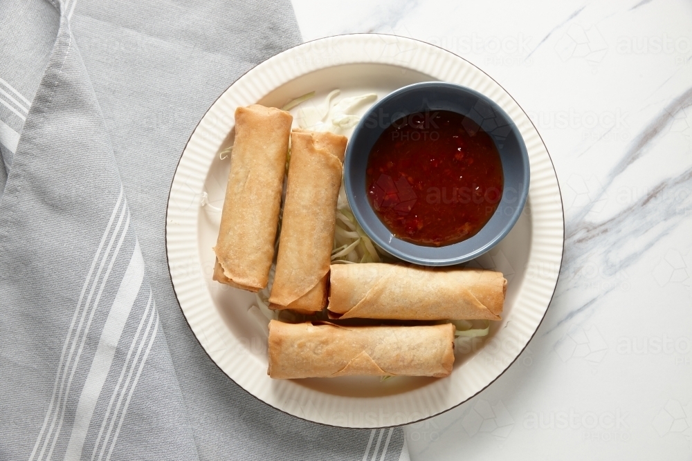 Image of top shot of spring rolls with ketchup - Austockphoto