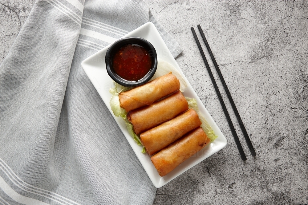 Image of top shot of spring rolls with ketchup - Austockphoto