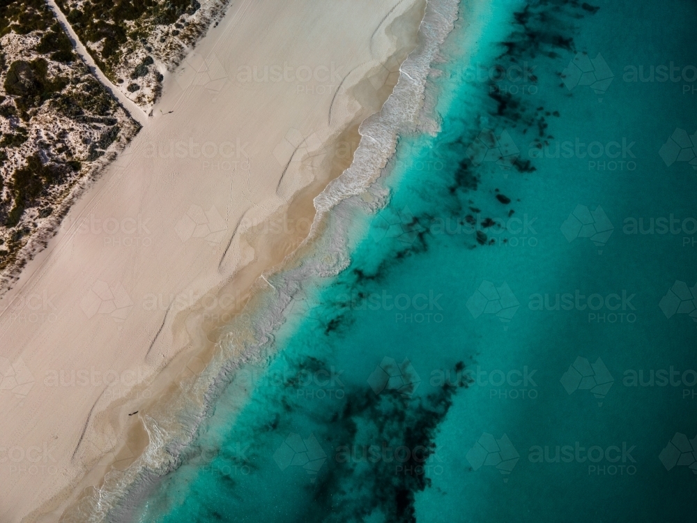 Image of top shot of Summers in Perth with white sand, green grass and ...