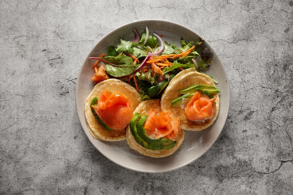 Image of Topdown shot of Salmon pikelets served with fresh garden salad ...