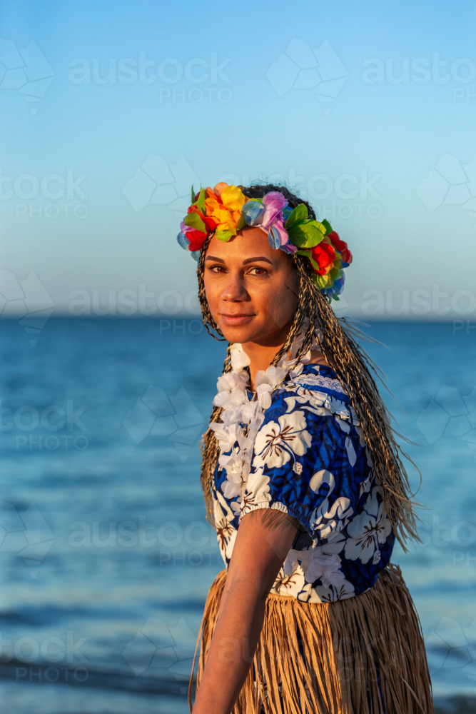 Image of Torres Strait Islander dancer performer woman in traditional floral dress and flower ...