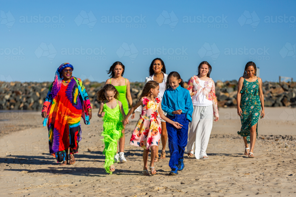 Image of Torres Strait Islander multi-generation family walking at the beach - Austockphoto