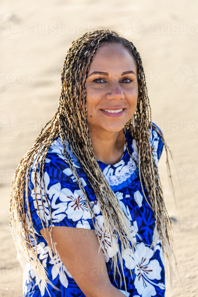Image of Torres Strait Islander woman in her thirties sitting in the ...