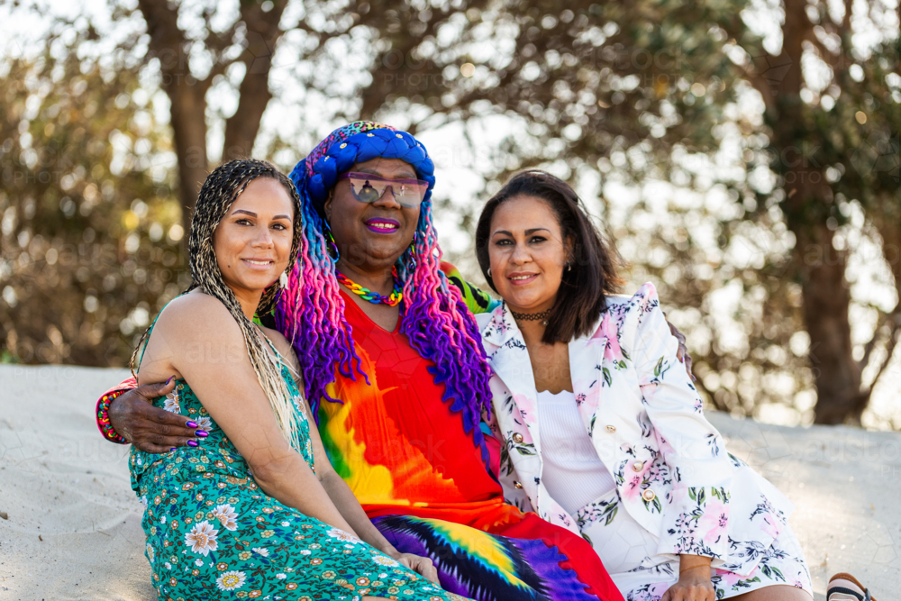 Image of Torres Strait Islander woman with her daughters sitting ...