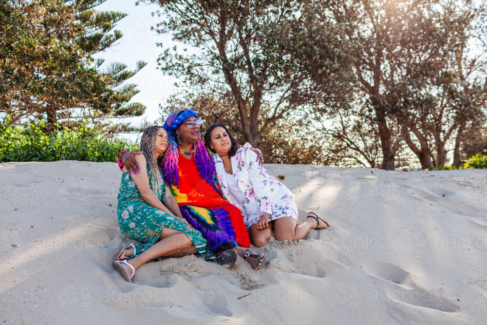 Image of Torres Strait Islander woman with her daughters sitting ...