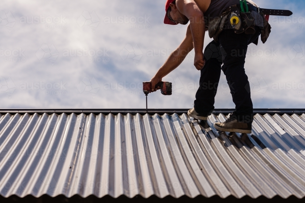 Image of tradie using power tool - Austockphoto