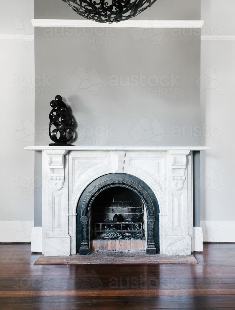 Image of traditional open fireplace with marble surround - Austockphoto