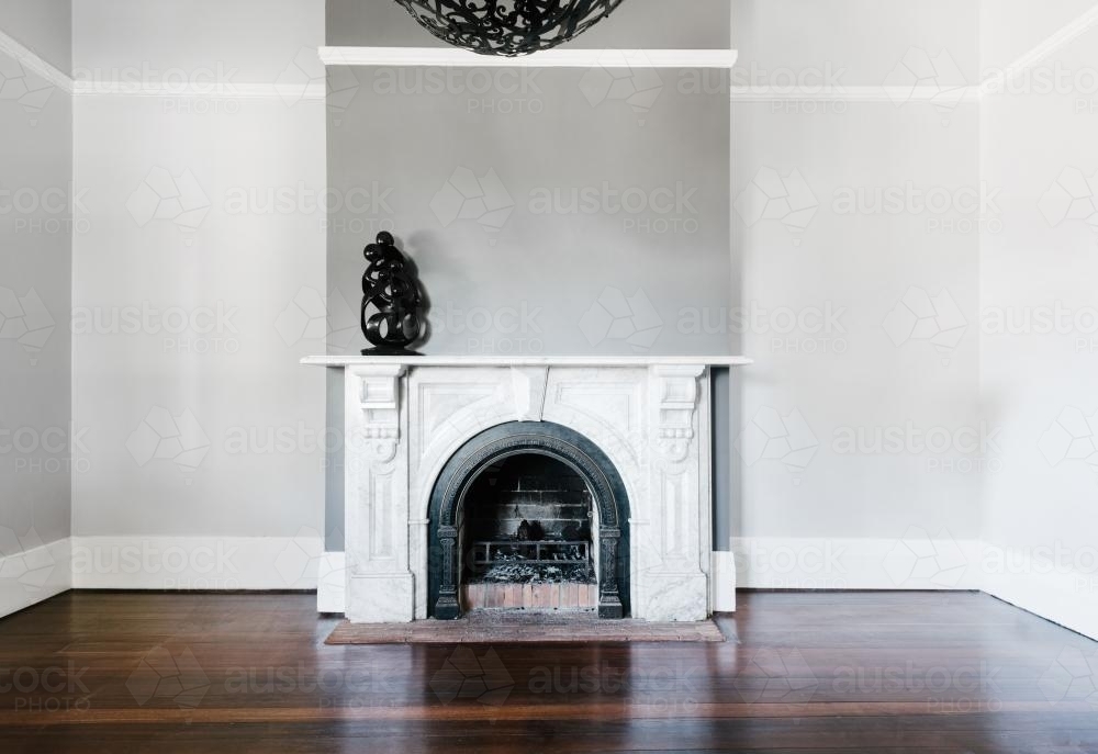 Image of traditional open fireplace with marble surround - Austockphoto