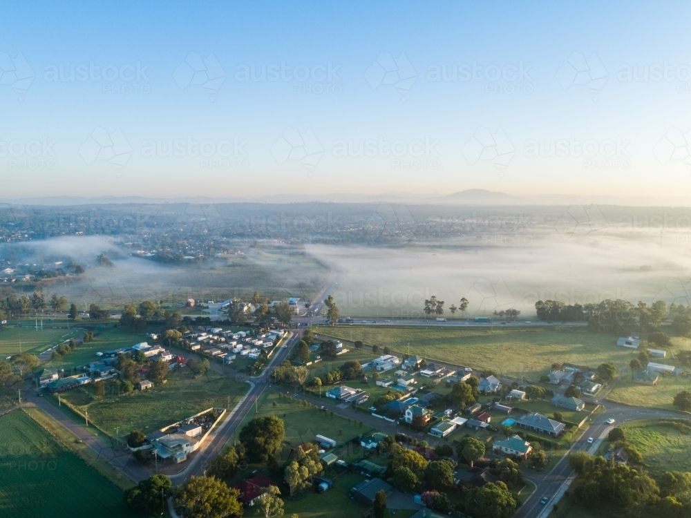 Image of Traffic lights intersection of highway through Singleton with ...