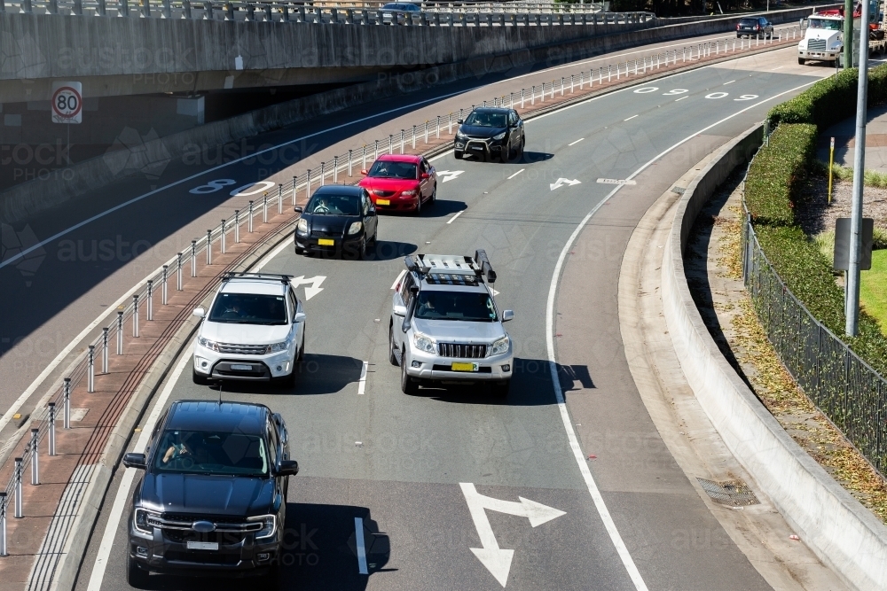 Image of Traffic on road approaching roundabout intersection seen from ...