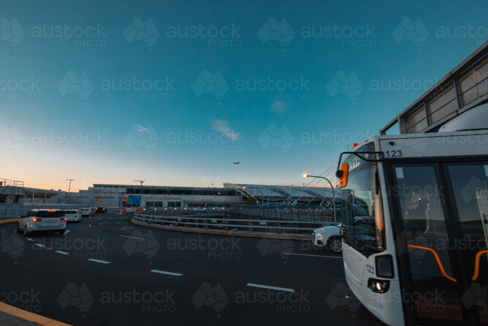 Image of Traffic on road at Sydney Domestic Airport with plane flying ...