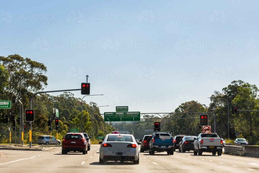 Image of Traffic with break lights on approaching intersection with ...