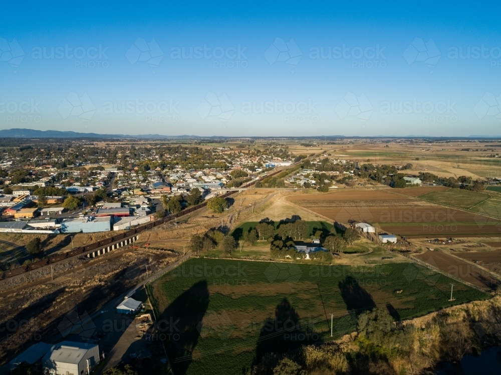 Image of Train line going along edge of town dividing homes from ...